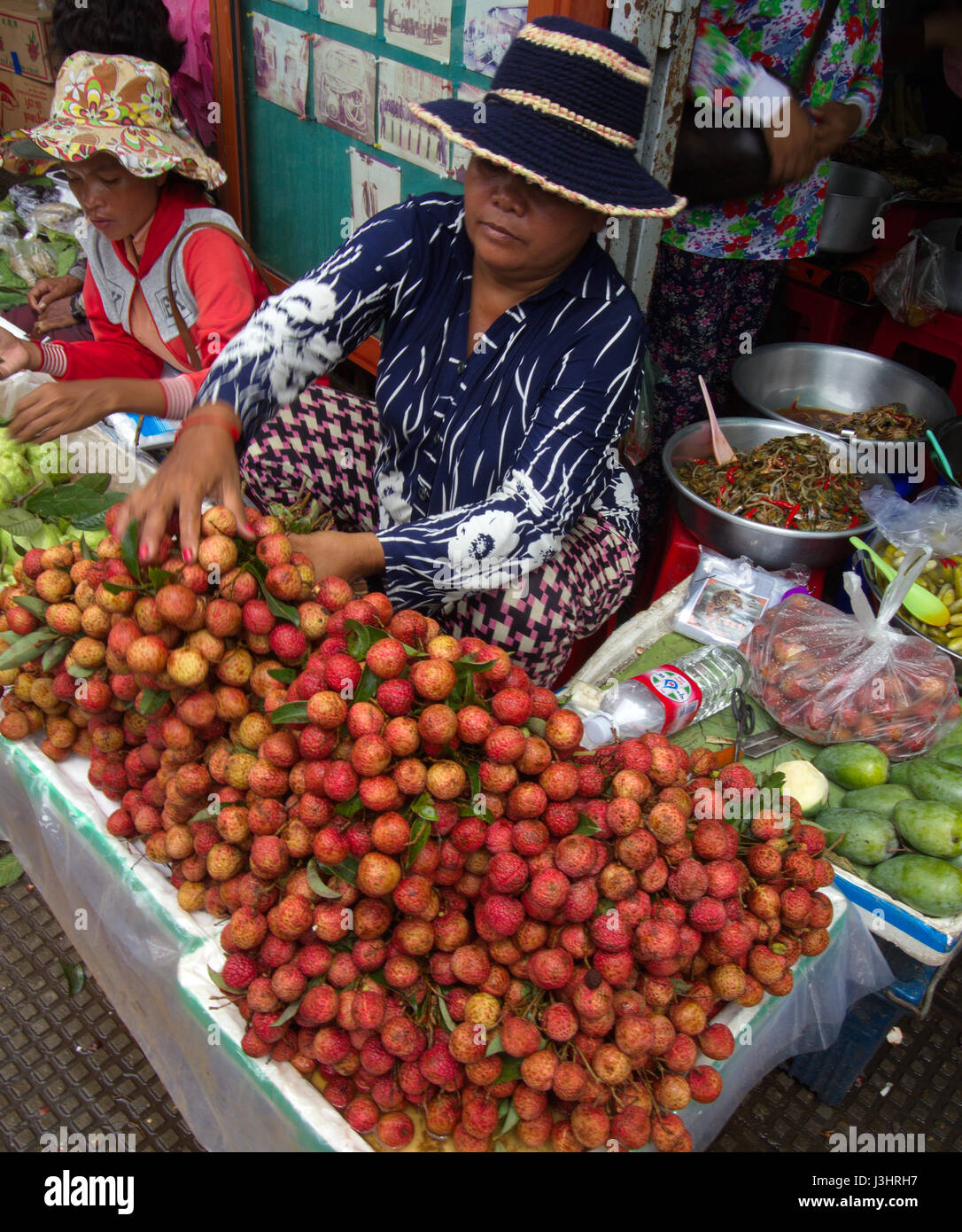 A lychee fruit vendor at the Central Market, Phnom Penh, Cambodia Stock ...