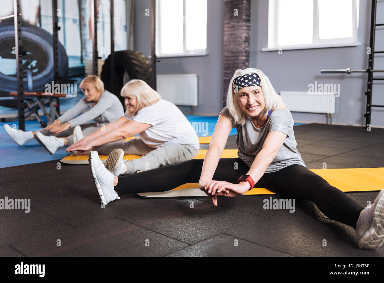 Senior woman doing splits hi-res stock photography and images - Alamy