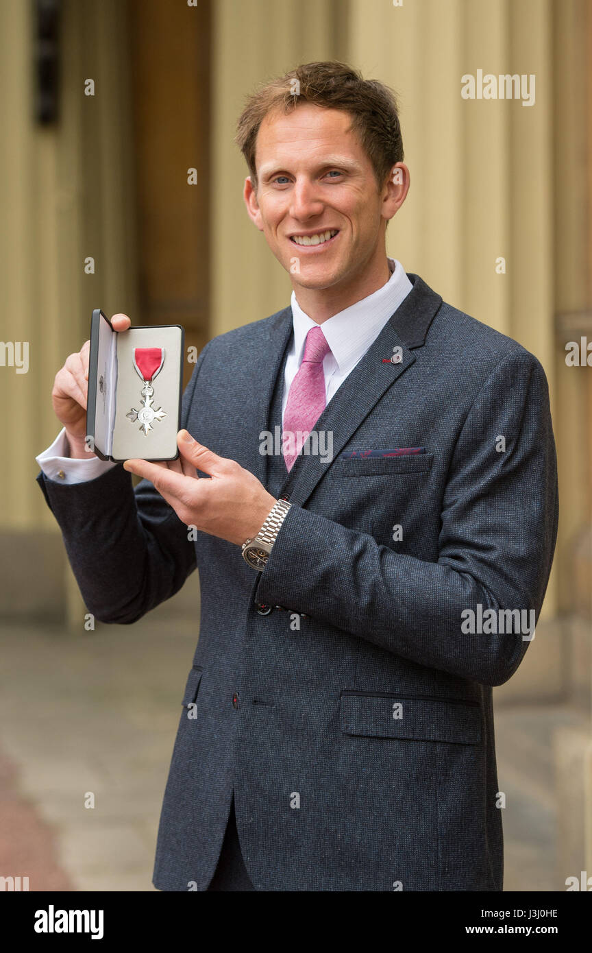 Rower Matt Langridge with his MBE medal, awarded by Queen Elizabeth II ...