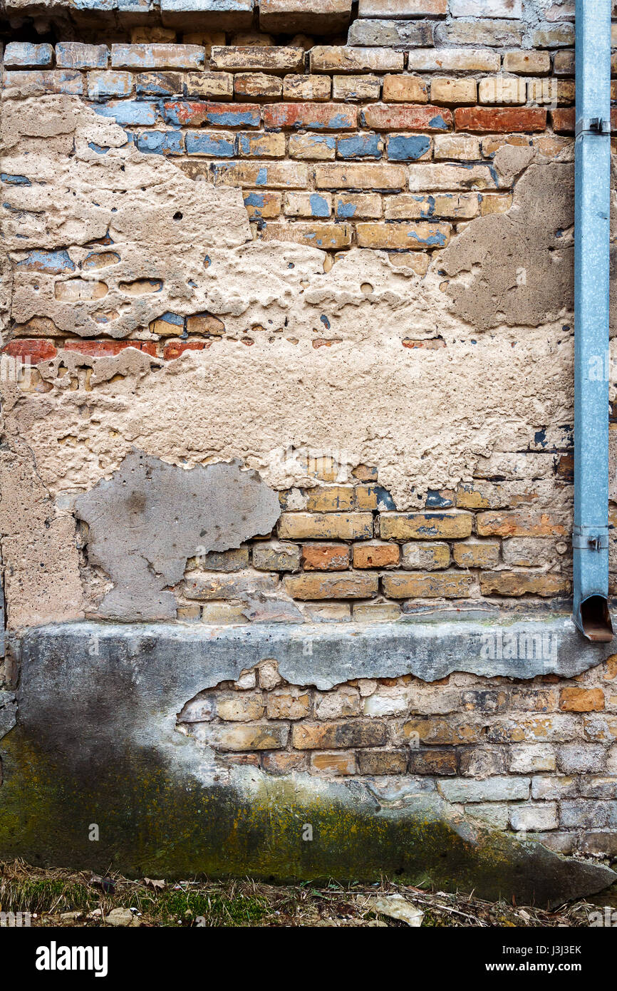 Old weathered street wall and a ground. Architecture detail background ...