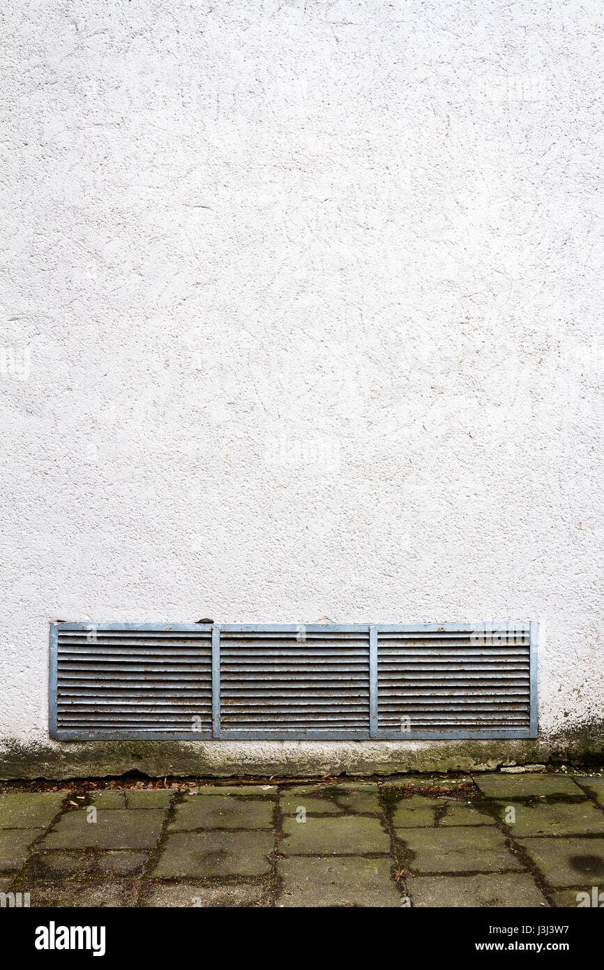 Modern white plaster street wall with ventilation grille. Architectural ...