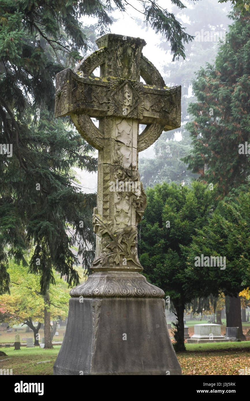 Large statue of a cross in an old Pioneer Cemetery Stock Photo - Alamy