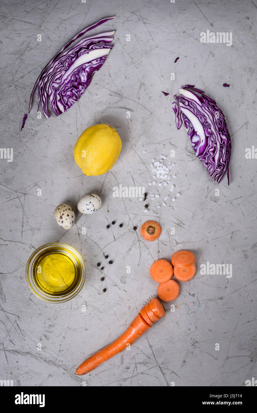 Clean eating ingredients over grey concrete background, top view, copy ...