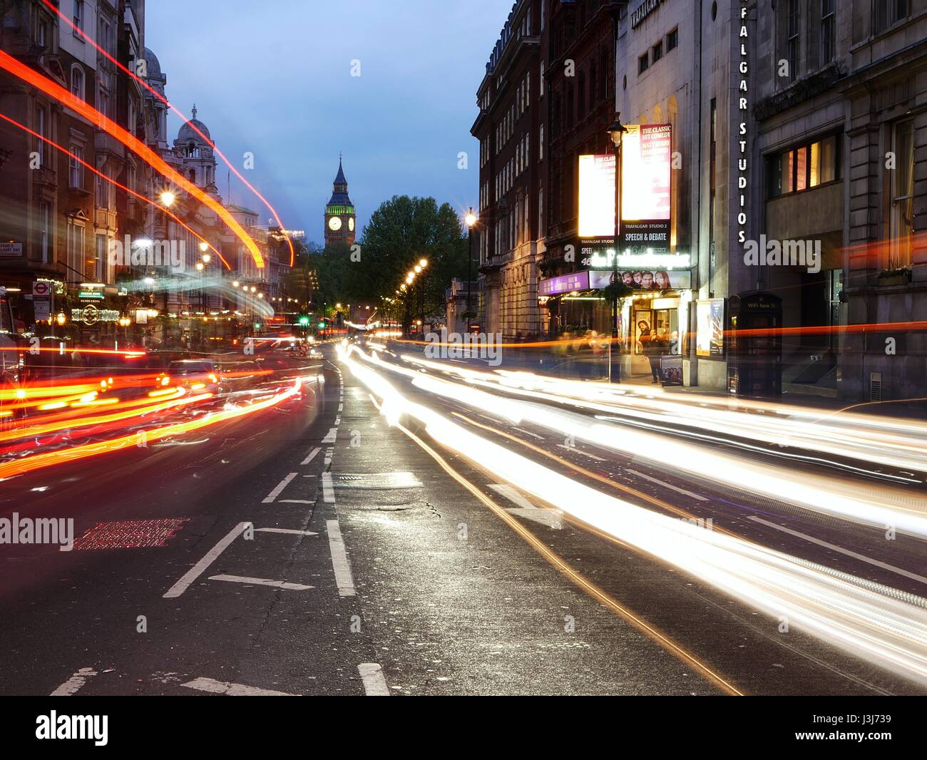 Light trails from cars and buses at Trafalgar Square, London, UK. Night ...