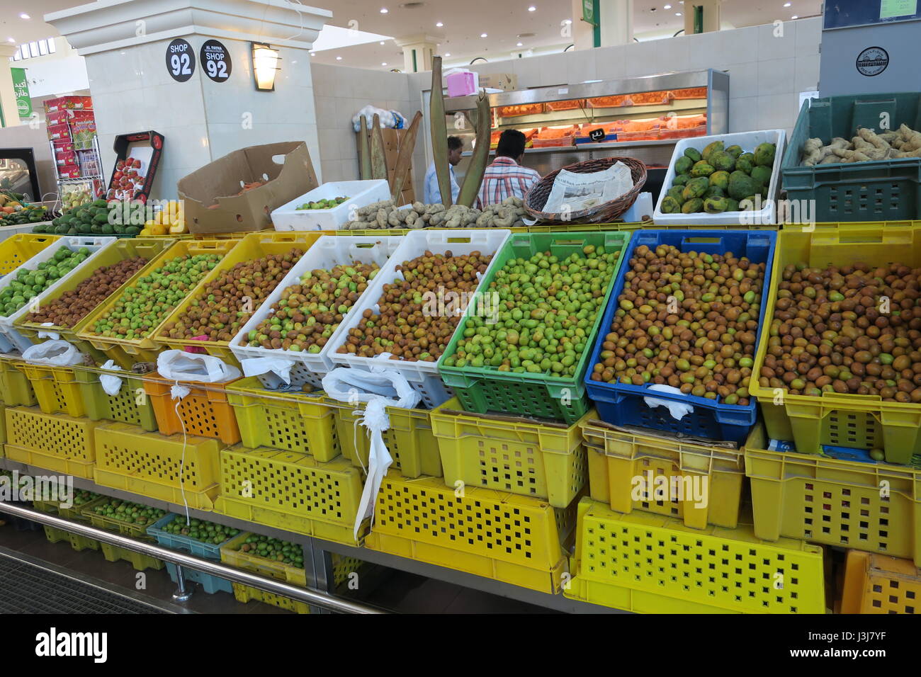 Lots of fresh fruit on market hall in Sharjah, Dubai, green and dark ...