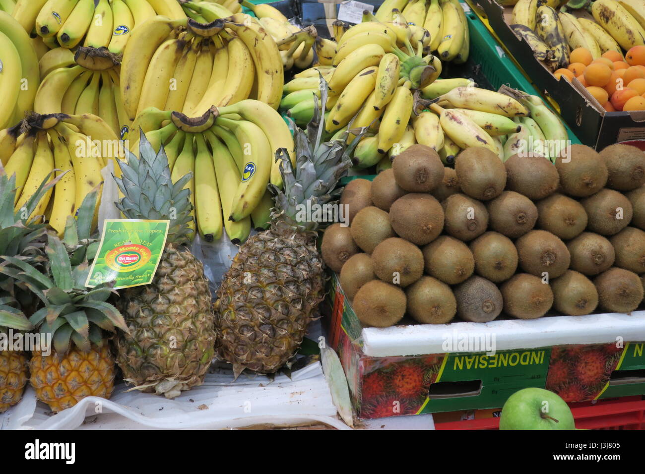 Lots of fresh fruit on market hall in Sharjah, Dubai, pineapples ...