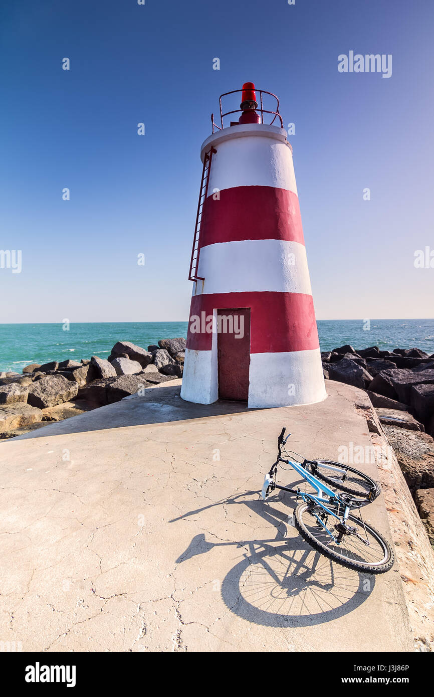 Lighthouse and bike in Portimao, Algarve, Portugal Stock Photo - Alamy