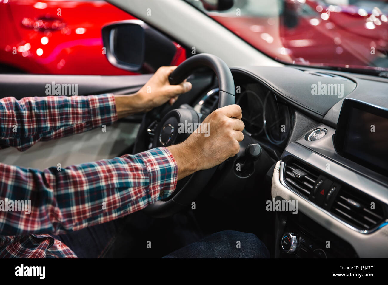 Handsome young man driving a modern car Stock Photo - Alamy
