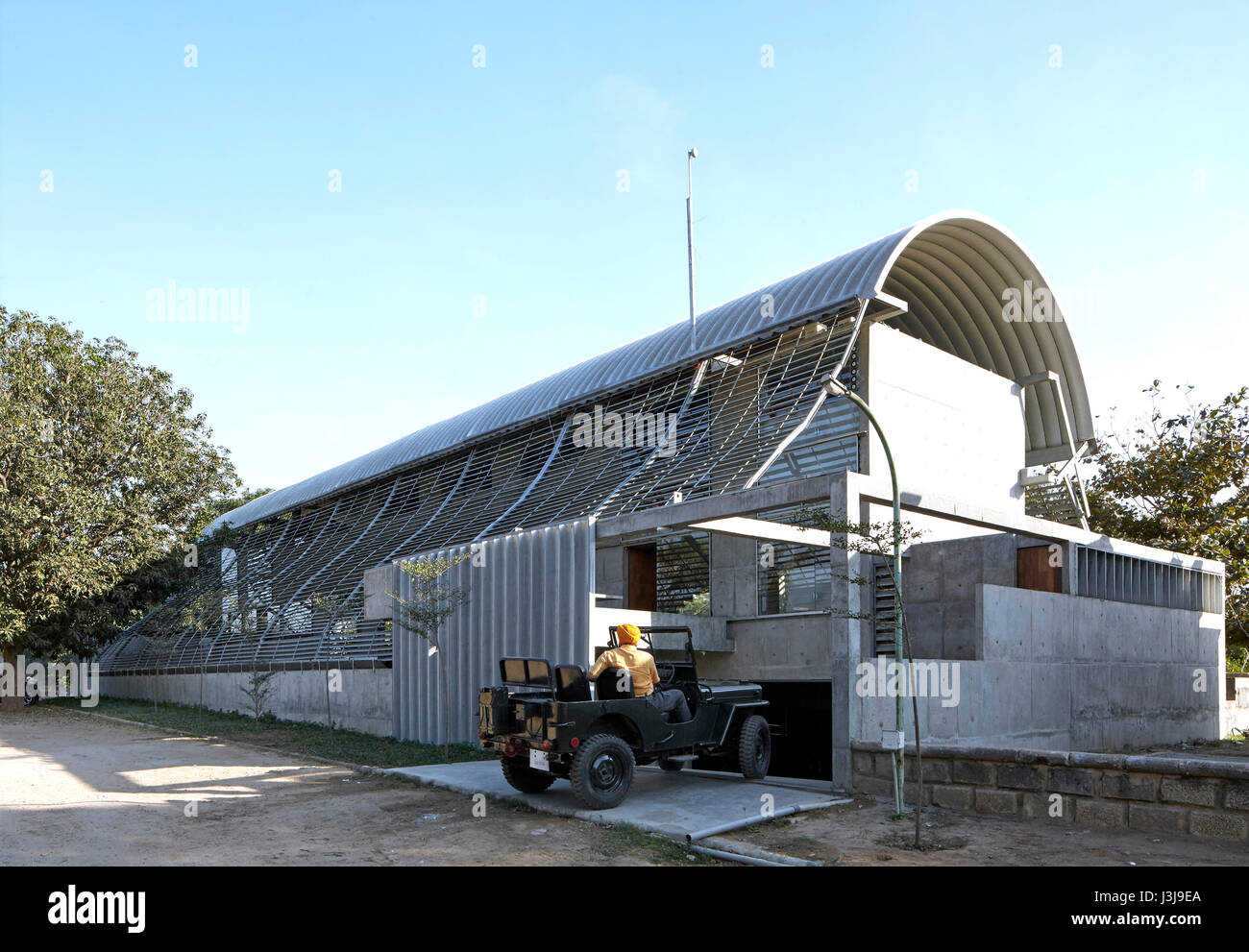 Street side exterior view with Gurjit Matharoo jeep. The Pool Studio of ...