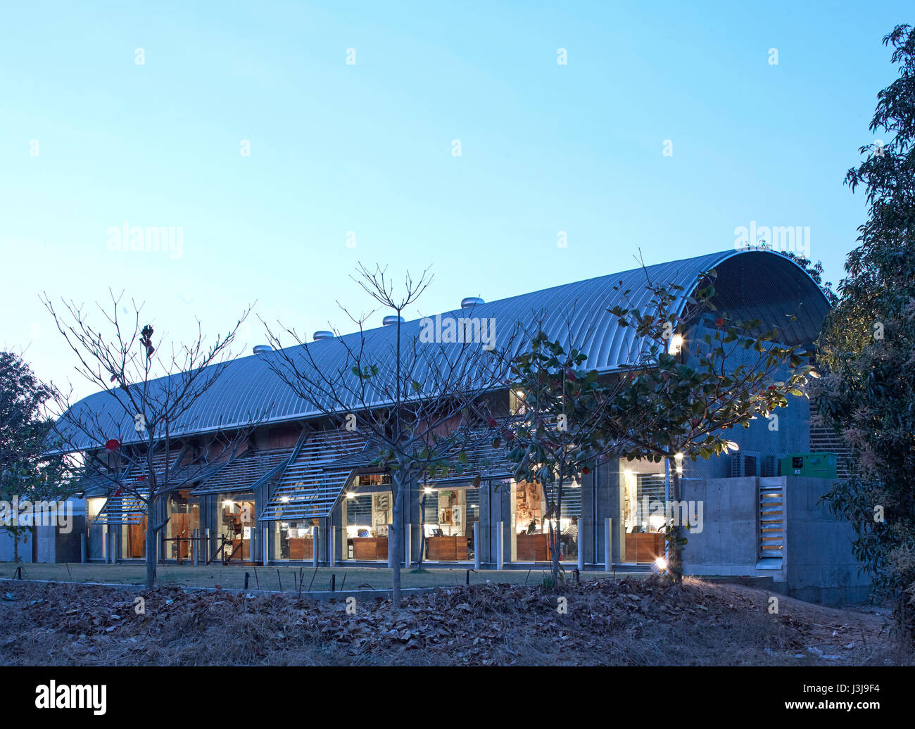 Garden side exterior view at dusk. The Pool Studio of Matharoo ...