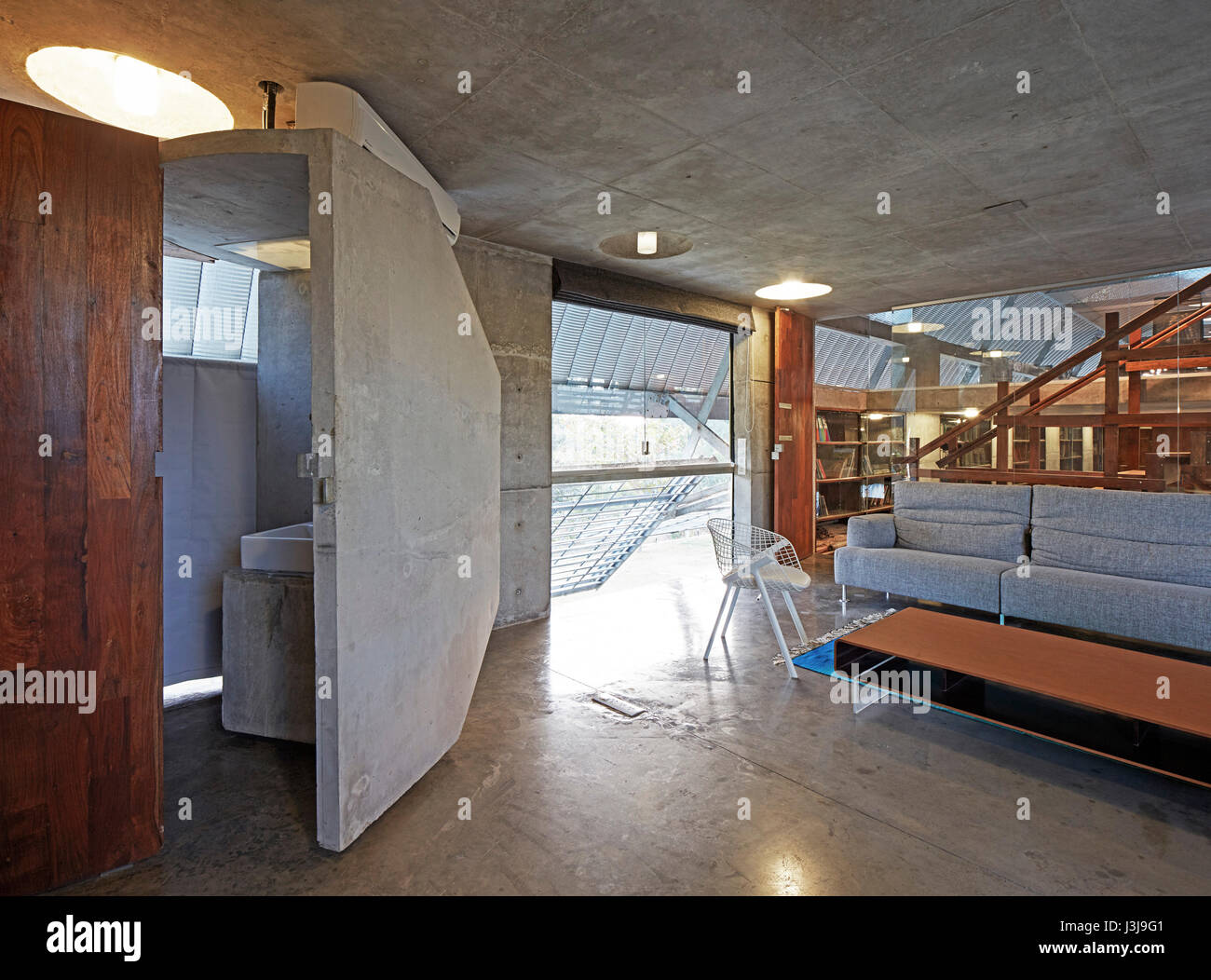 Sitting room with cast concrete toilet on upper floor. The Pool Studio ...