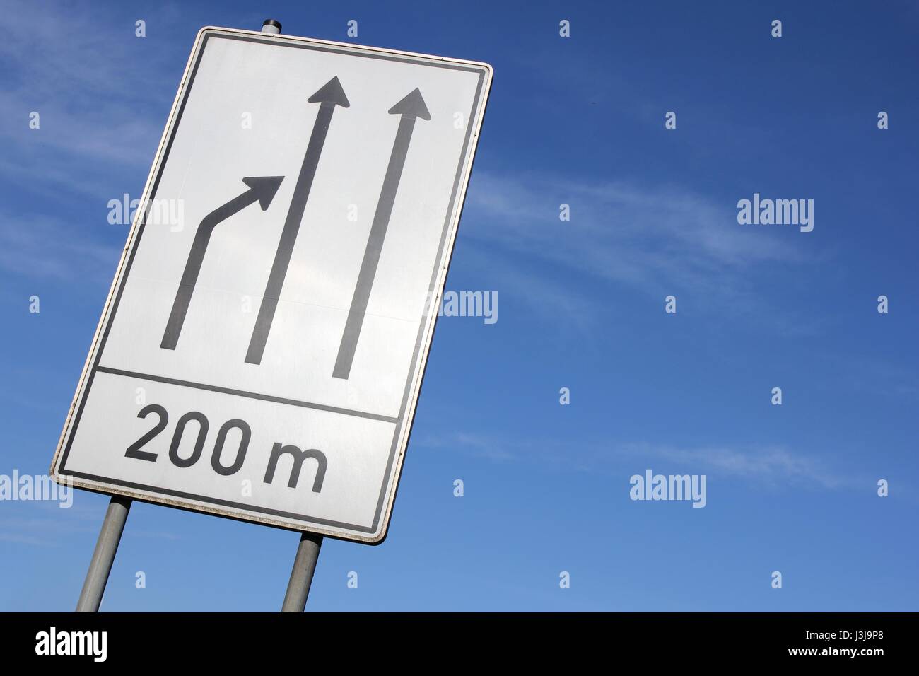 German road sign: end of lane in 200 m Stock Photo - Alamy