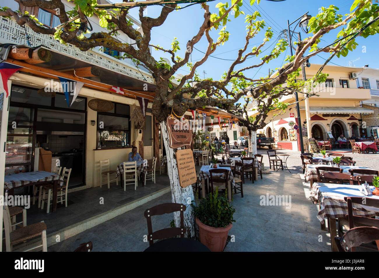 The main market square in a small village Mochos on Crete Island ...