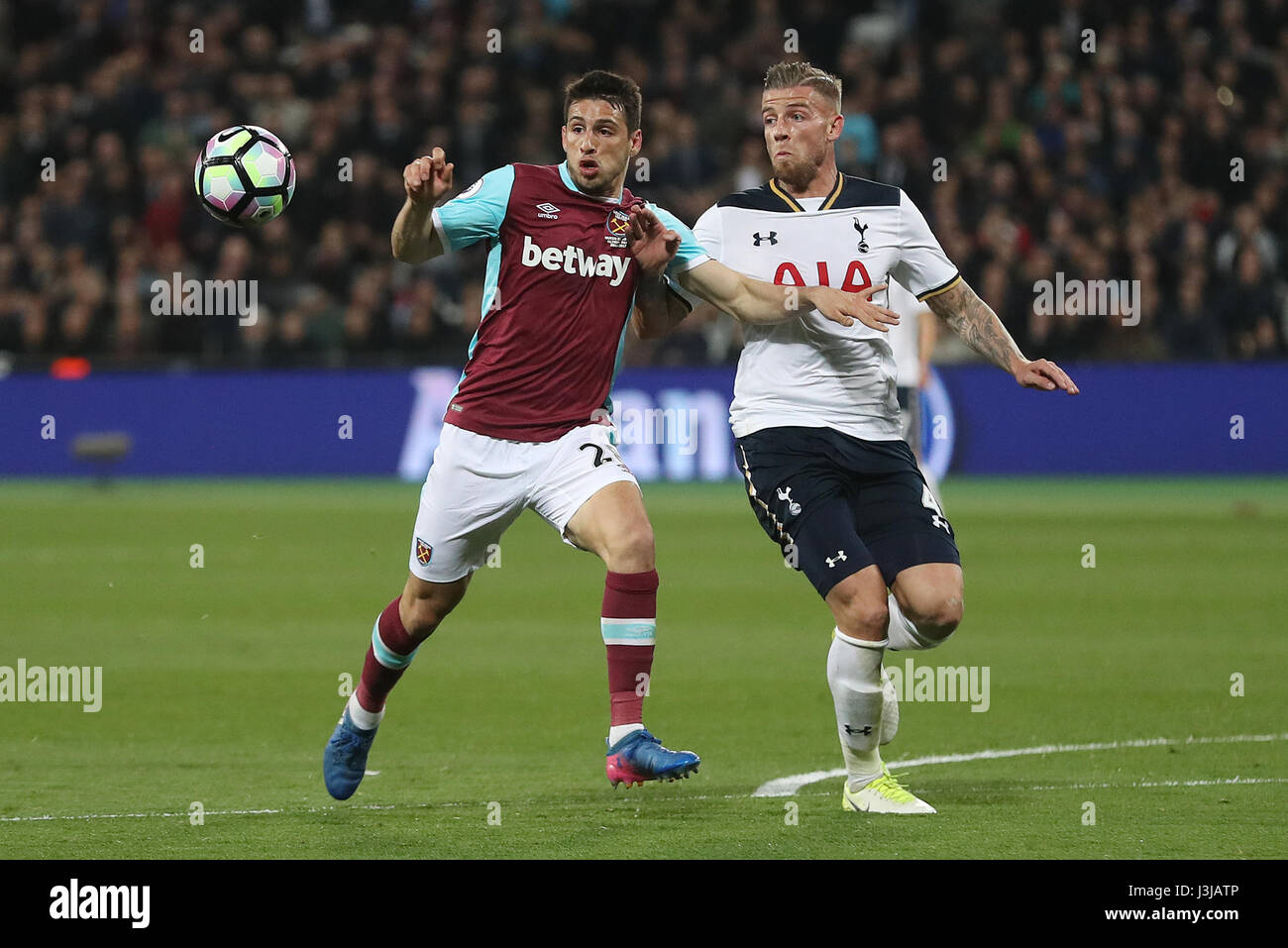 West Ham United's Jonathan Calleri and Tottenham Hotspur's Toby ...