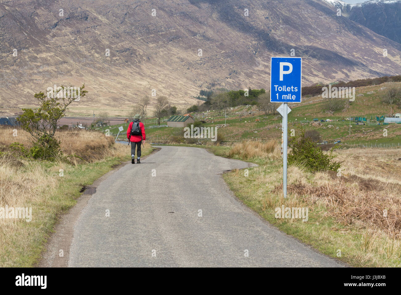 Public toilets - middle aged man walking past sign saying toilets 1 ...