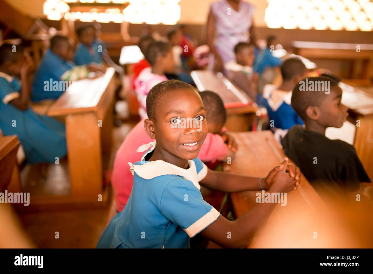 A school girl in uniform at the classroom near to Batoufam City at West ...