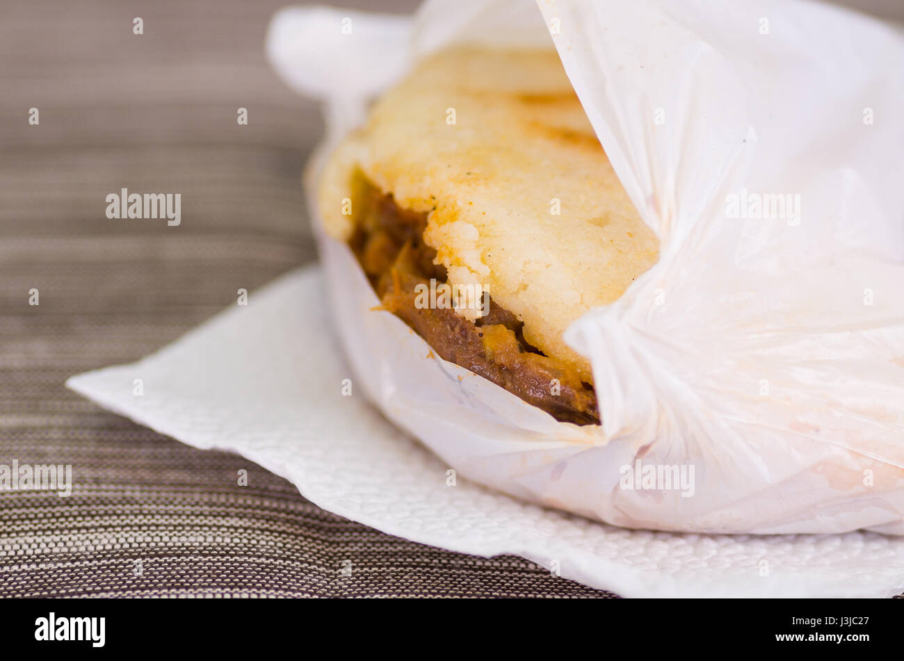 Close up of a traditional delicious arepas, shredded chicken avocado ...