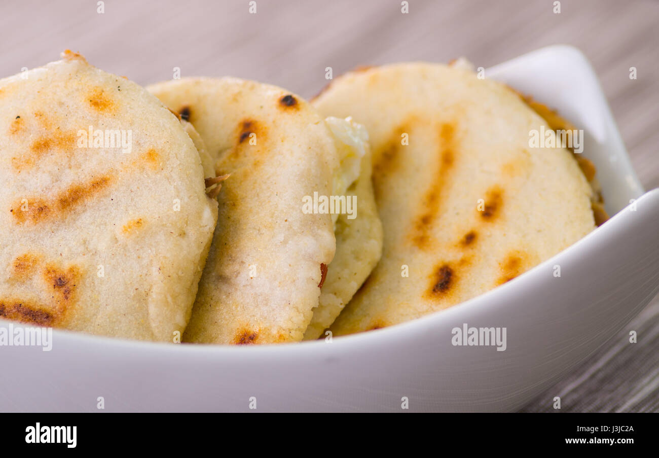 Close up of a traditional delicious arepas, shredded chicken avocado ...