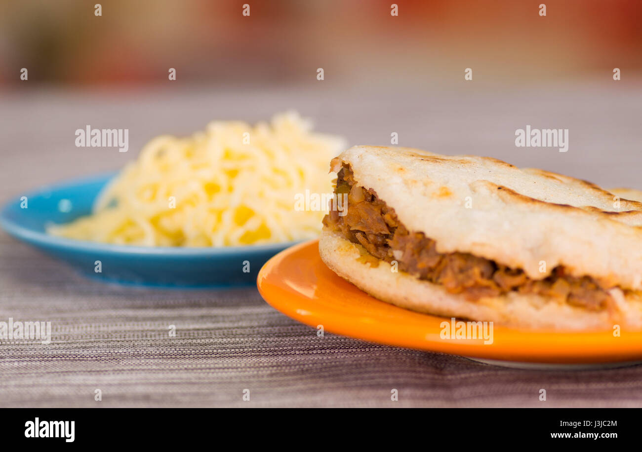 Traditional delicious arepas, shredded chicken avocado and cheddar ...