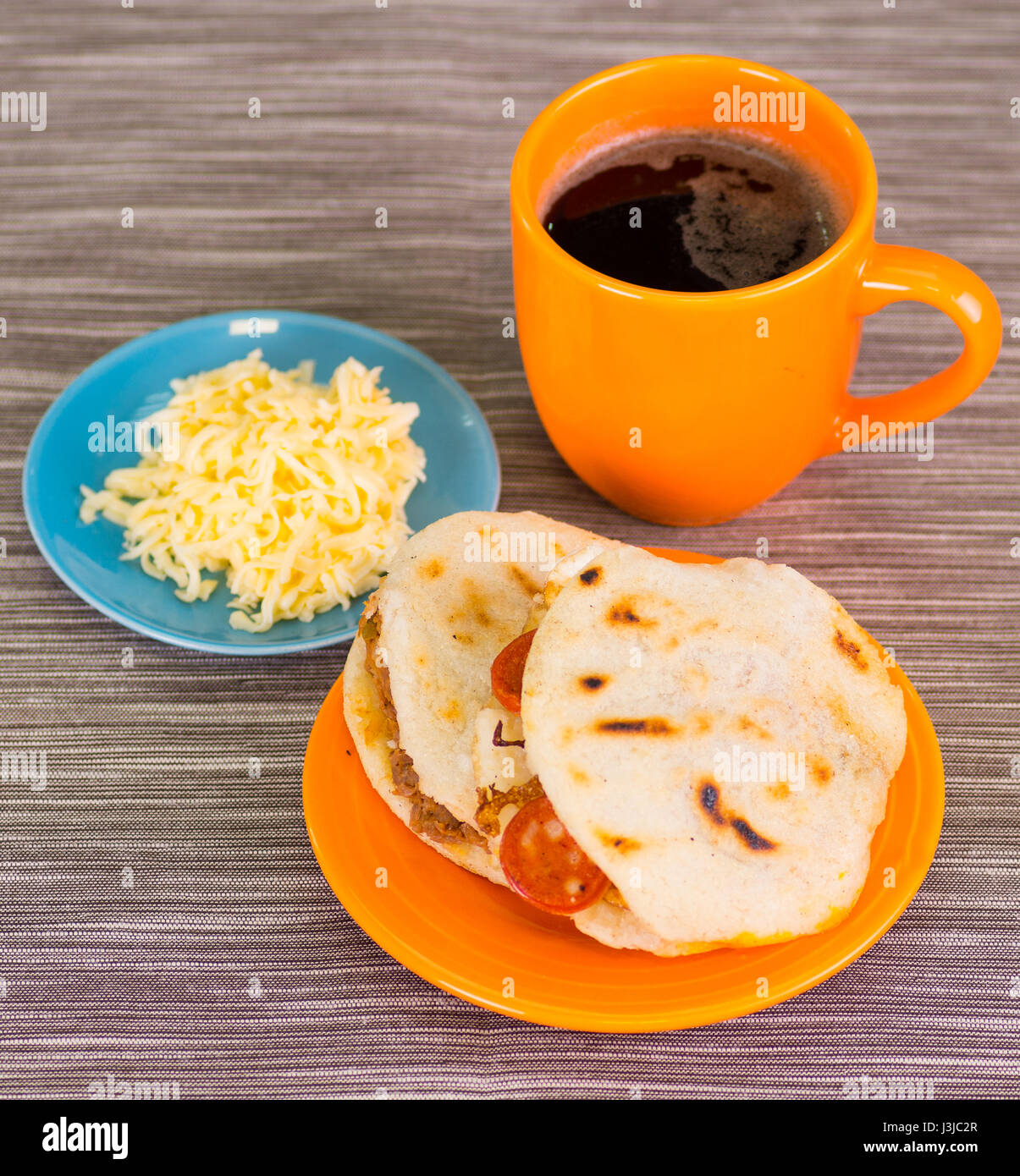 Traditional delicious arepas, shredded chicken avocado and cheddar ...