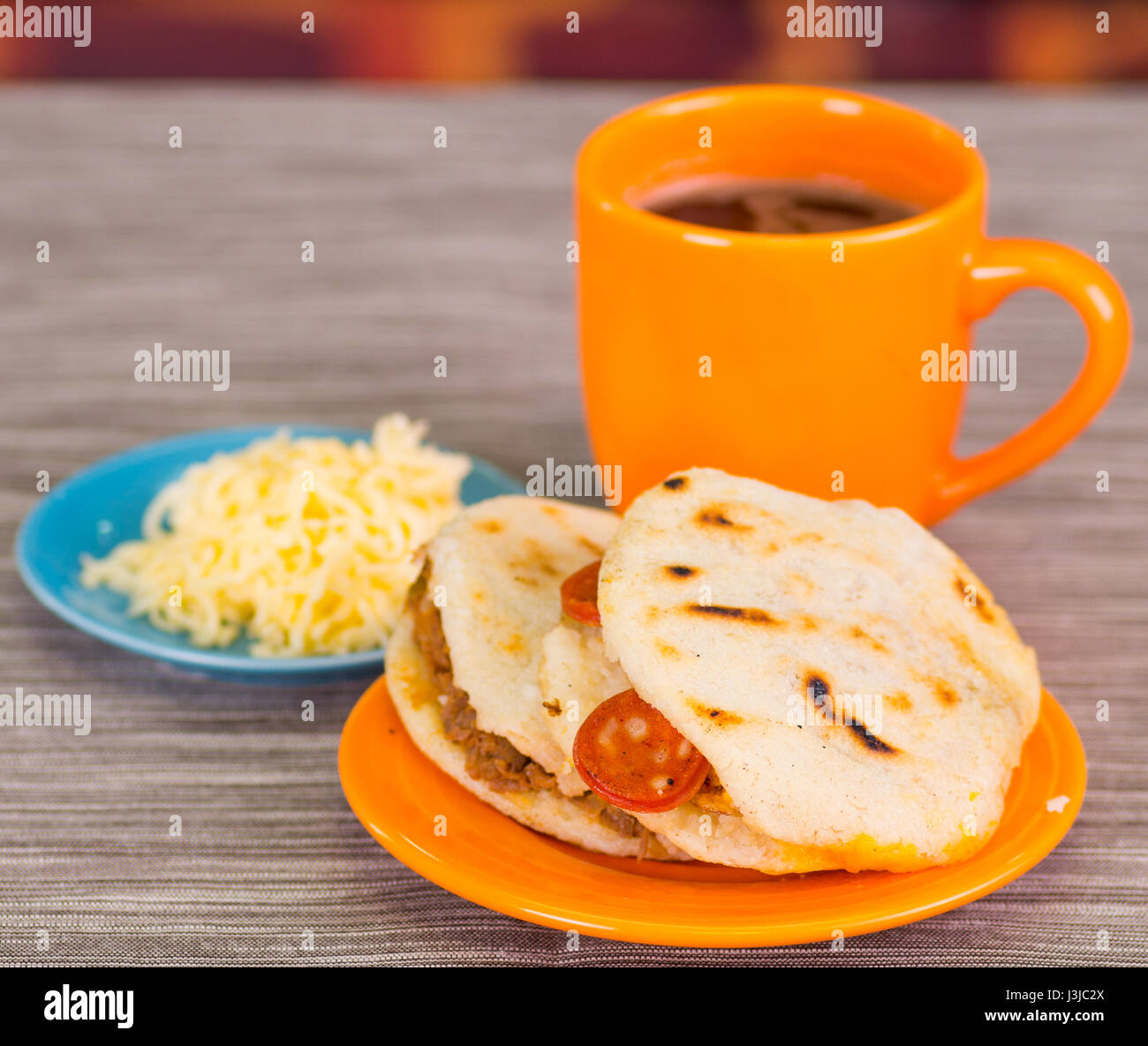 Traditional delicious arepas, shredded chicken avocado and cheddar ...