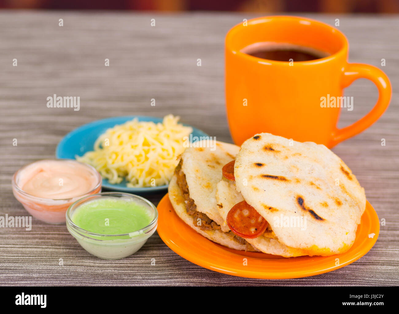 Traditional delicious arepas, shredded chicken avocado and cheddar ...