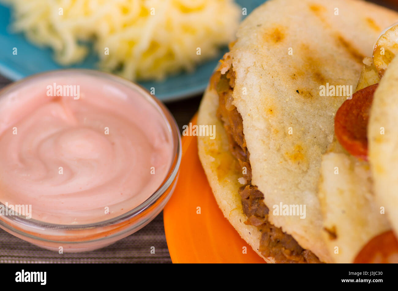 Closeup of a traditional delicious arepas, shredded chicken avocado and ...