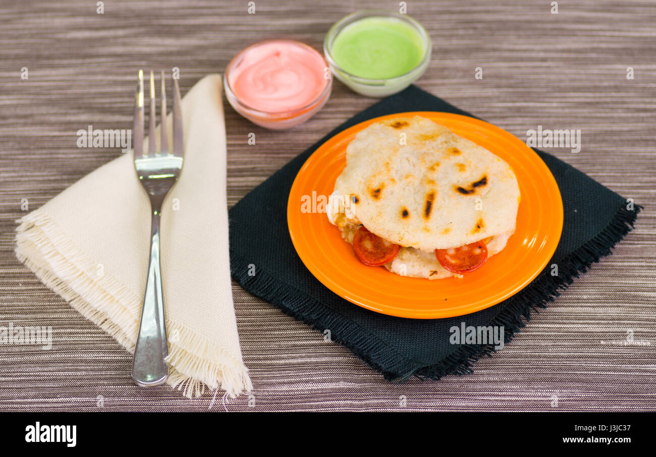 Traditional delicious arepas, shredded chicken avocado and cheddar ...