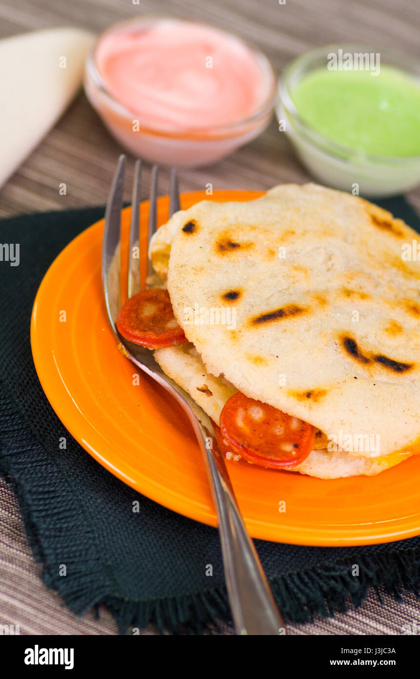 Closeup of a delicious traditional arepas, shredded chicken avocado and ...