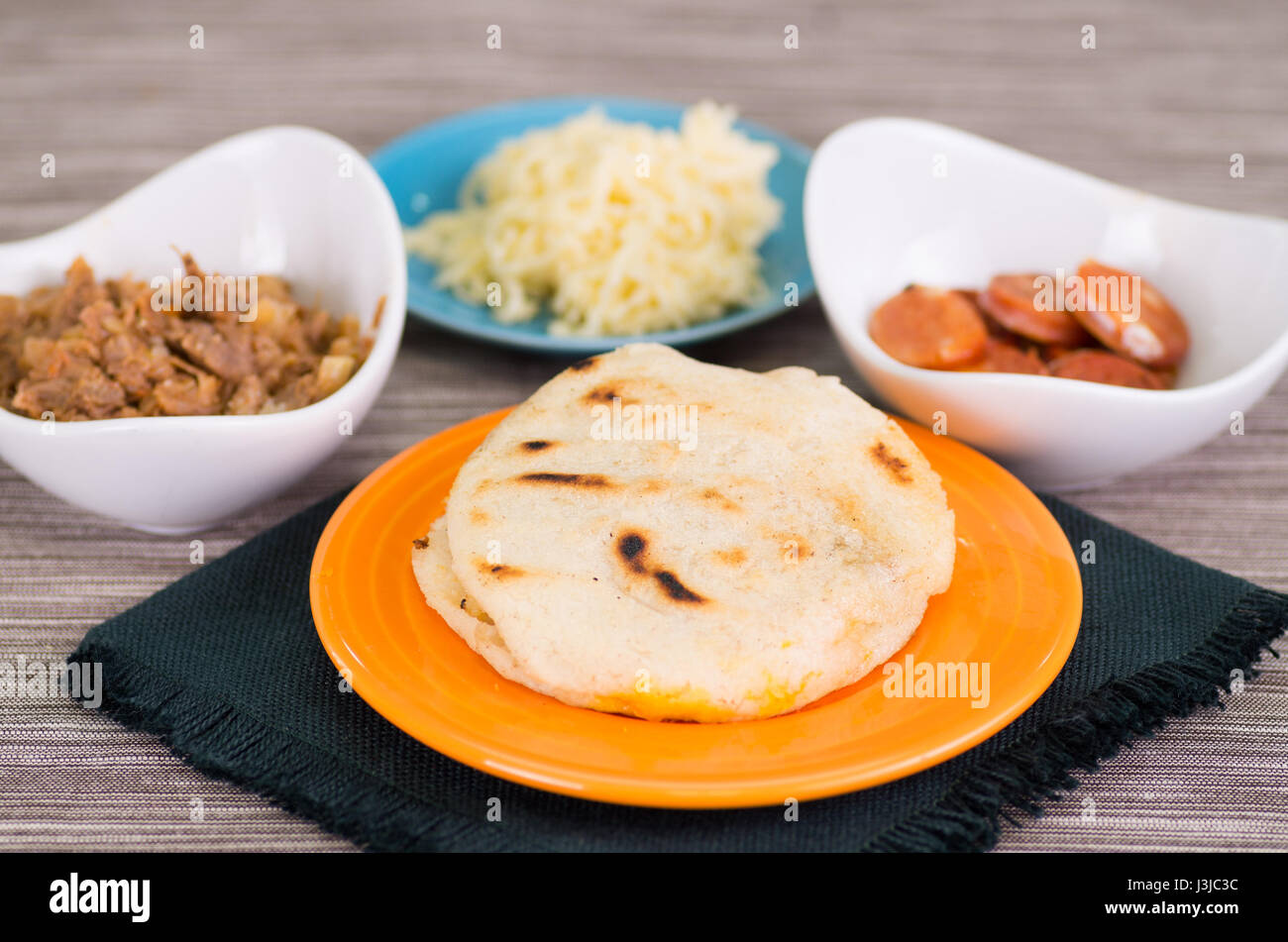Close up of a traditional delicious arepas, shredded chicken avocado ...