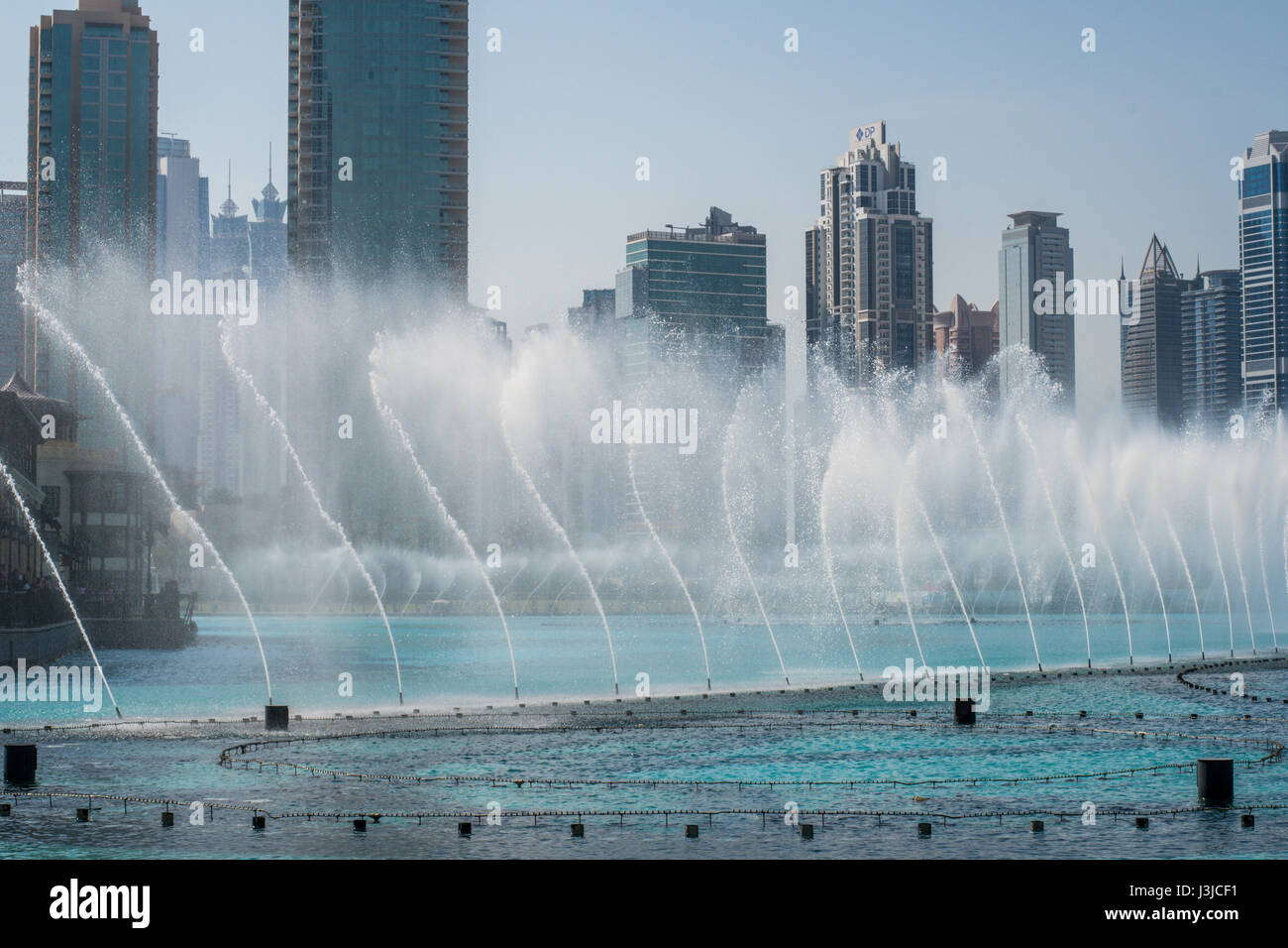 Dubai; United Arab Emirates - Lines of water from water fountain in the ...