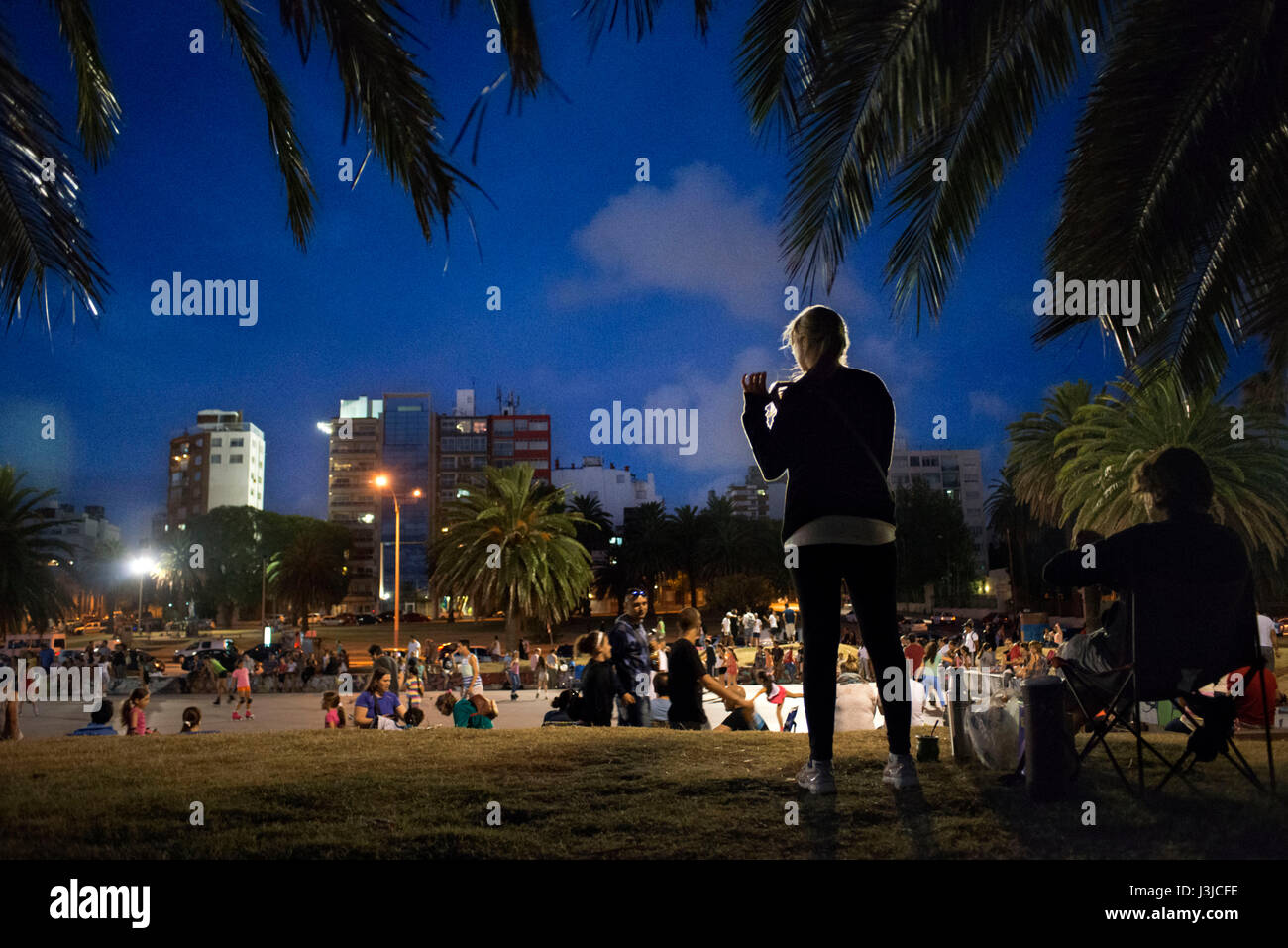 Skating, relaxing and drinking mate at sunset in the open skating rink ...