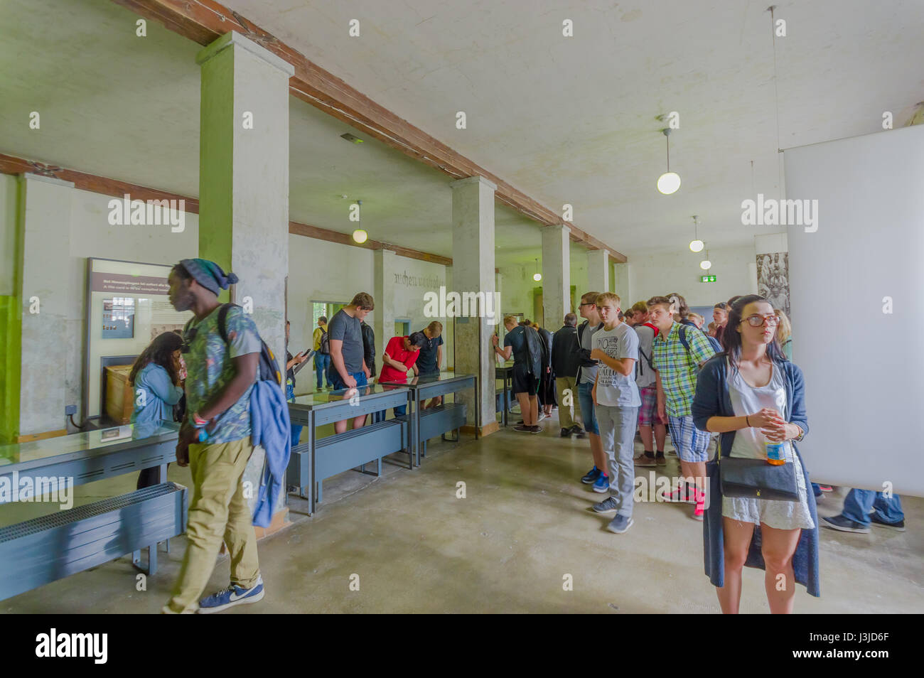 Dachau, Germany - July 30, 2015: Crowd of people looking inside museum ...