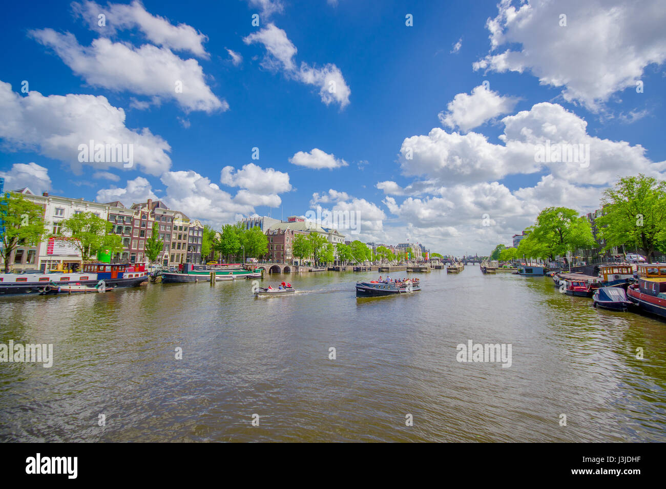 Amsterdam, Netherlands - July 10, 2015: Large water channel running ...
