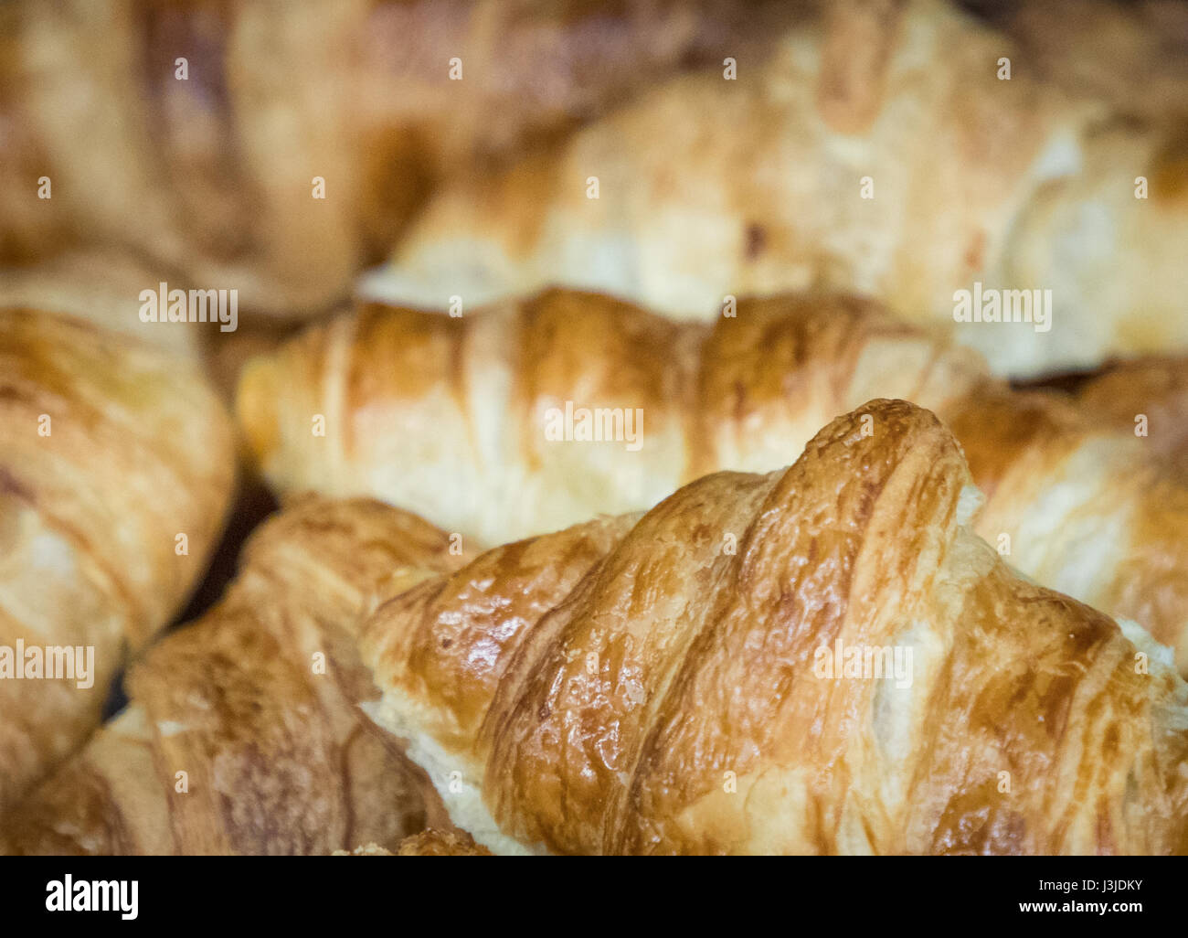 many crossiant together in a basket Stock Photo - Alamy