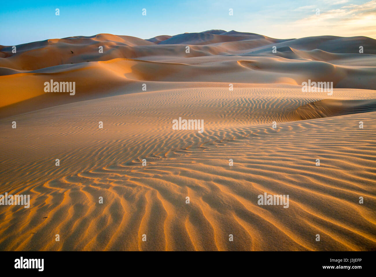 Liwa Oasis, Abu Dhabi , United Arab Emirates -, sunlight over rippling ...