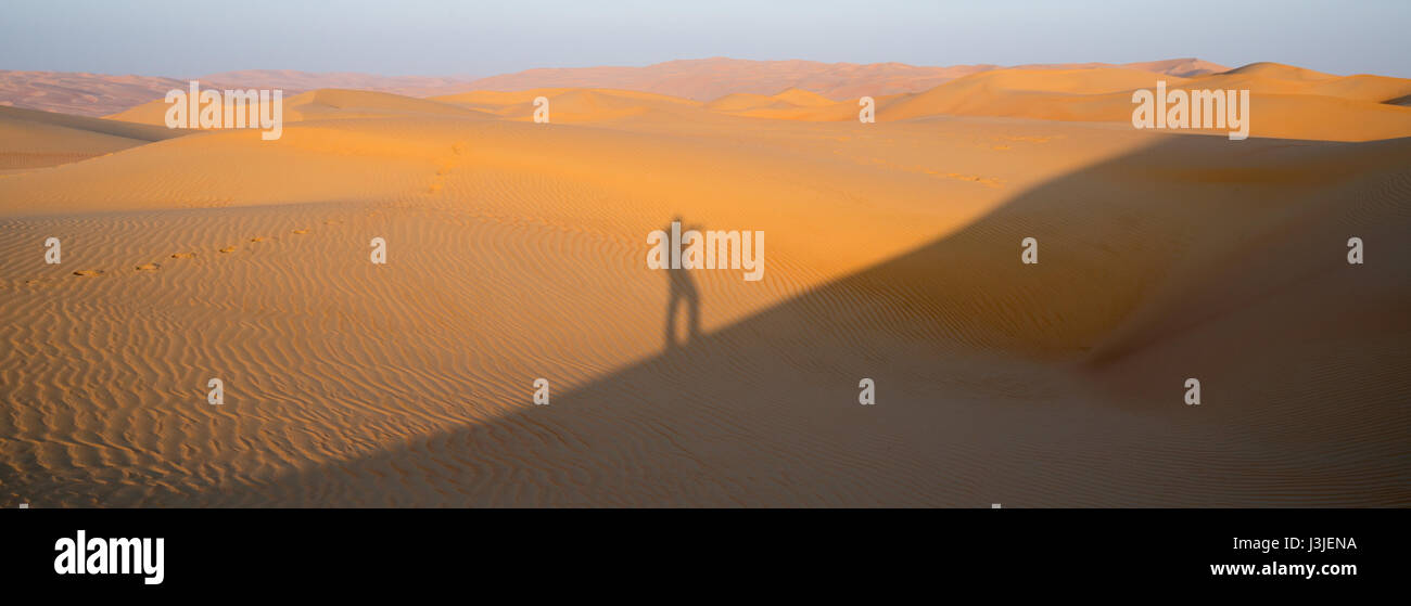 Liwa Oasis, Abu Dhabi , United Arab Emirates -, shadow of hiker in the ...