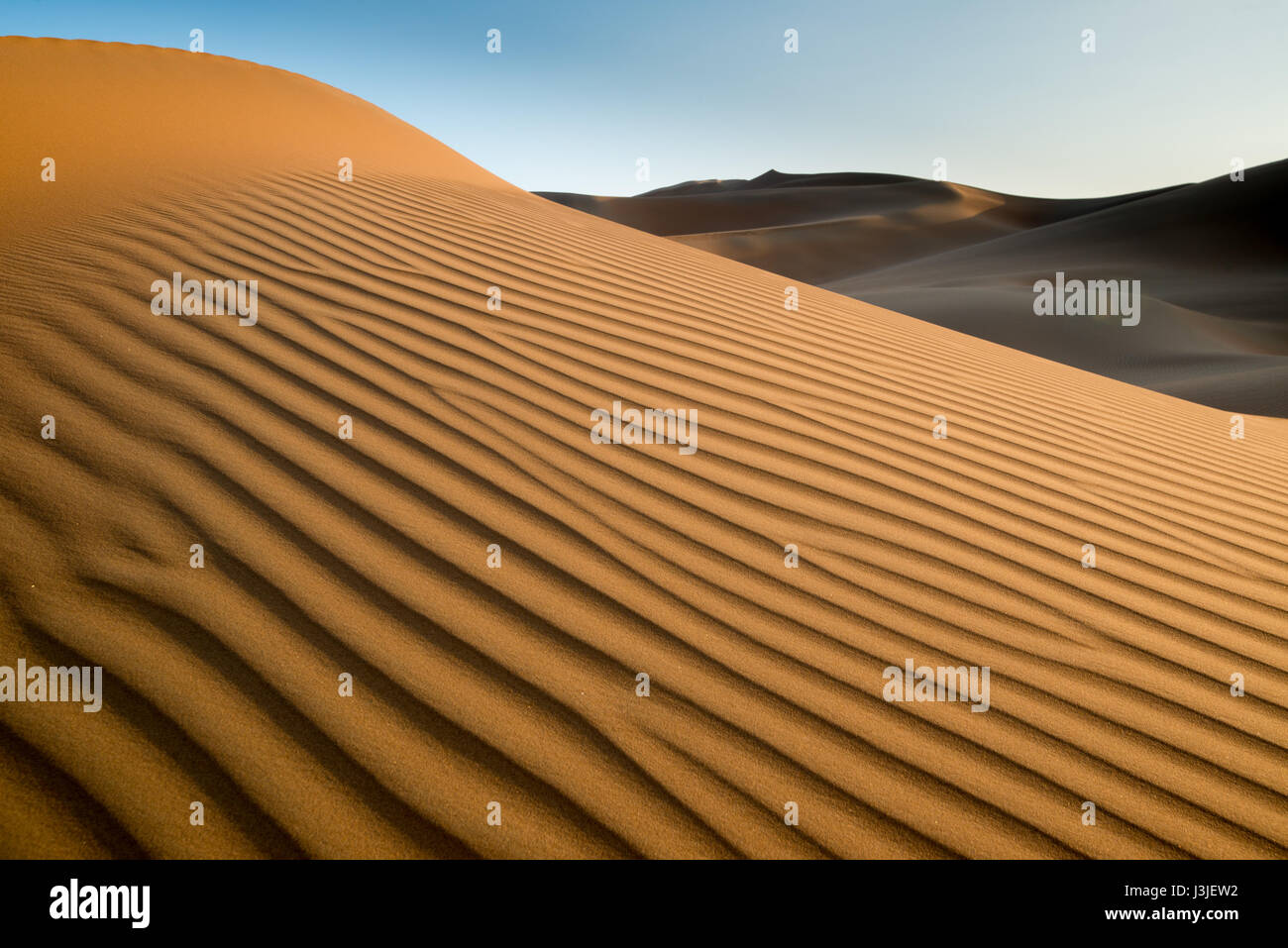 Liwa Oasis, Abu Dhabi , United Arab Emirates -, sunlight over rippling ...
