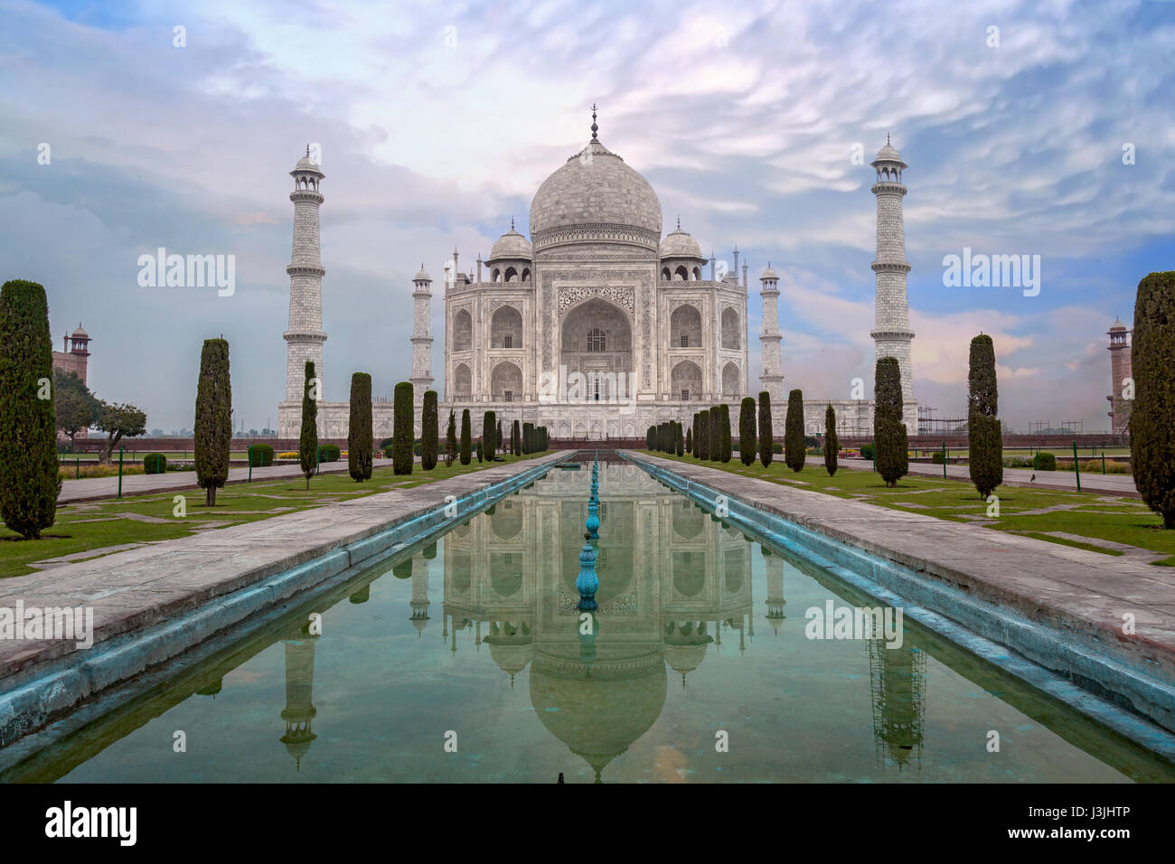 Taj Mahal at sunrise. Taj Mahal is a white marble mausoleum at Agra ...