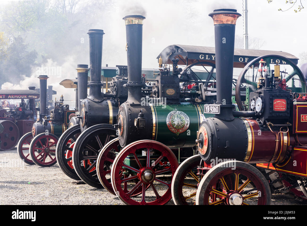 Smoke comes from the chimneys from lots of traction engines at a steam ...