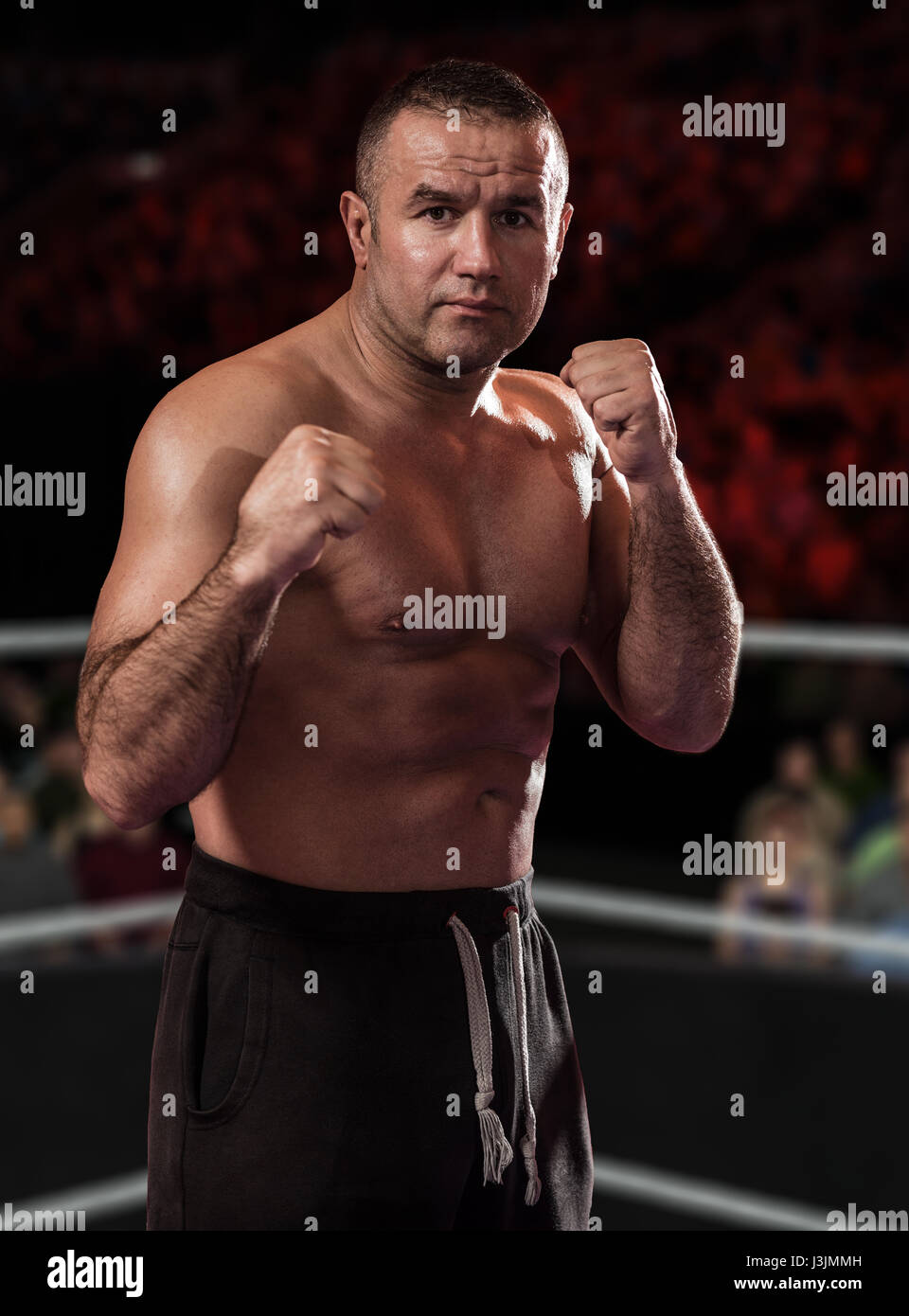 professional kickboxer with hands in martial arts position training for ...