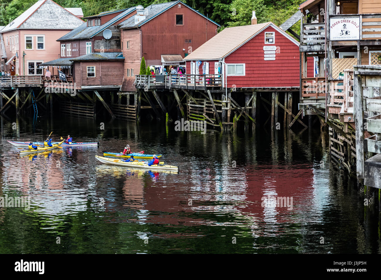 Adventurers kayaking on Creek Street in Ketchikan, Alaska Stock Photo ...