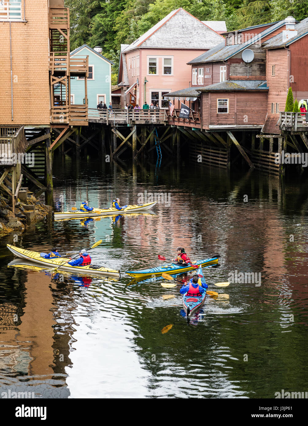 Adventurers kayaking on Creek Street in Ketchikan, Alaska Stock Photo ...