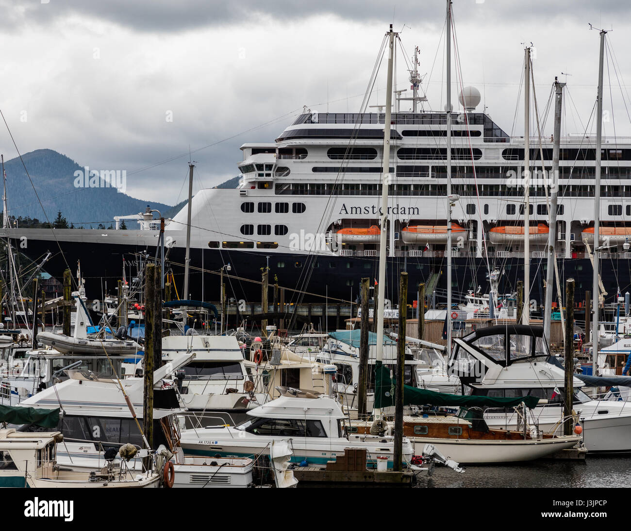 Fishing boats alongside a cruise ship in the Alaskan port of Ketchikan ...