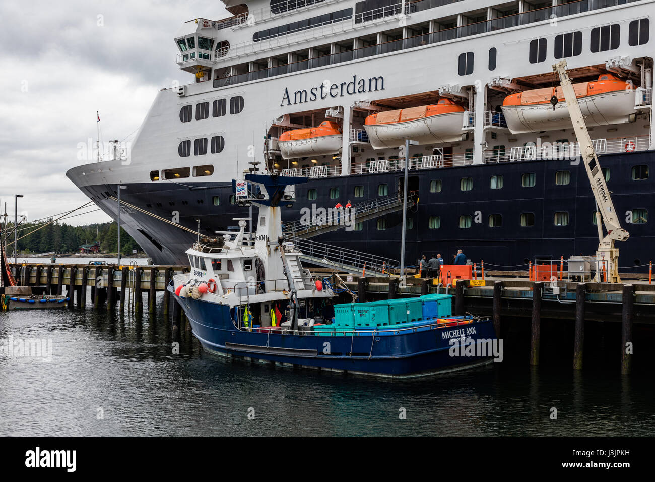 Fishing boats alongside a cruise ship in the Alaskan port of Ketchikan ...