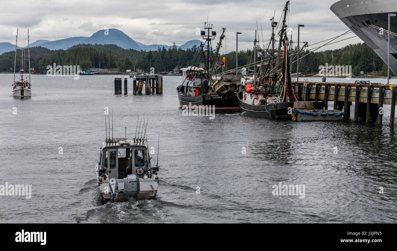 Fishing boats alongside a cruise ship in the Alaskan port of Ketchikan ...