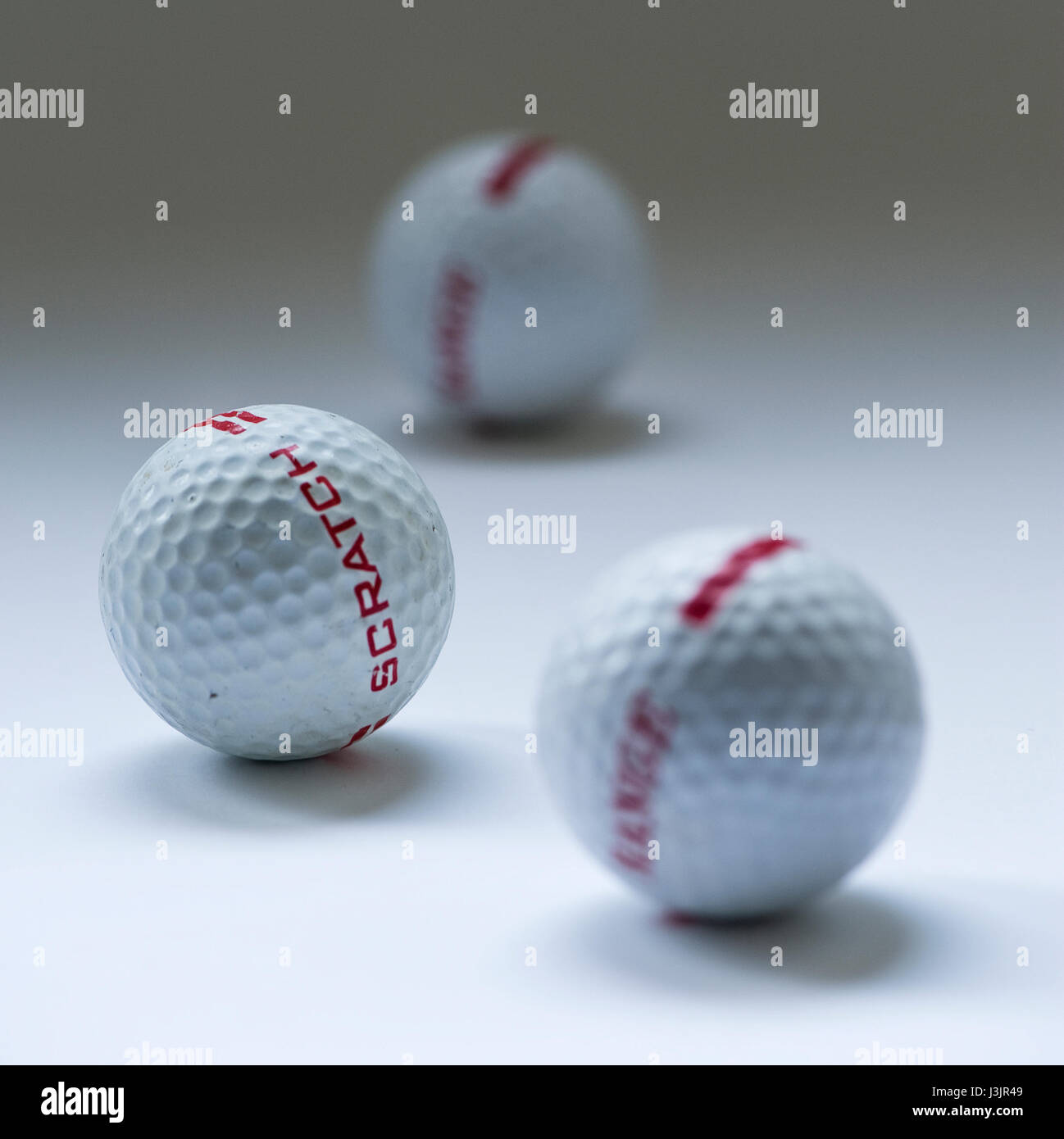 three golf balls Stock Photo - Alamy