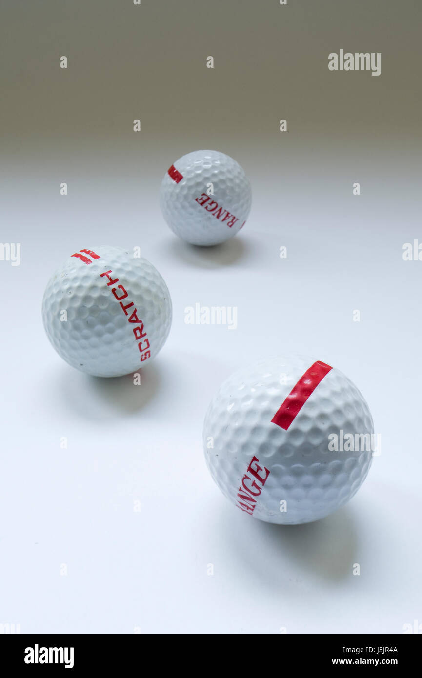 three golf balls Stock Photo - Alamy