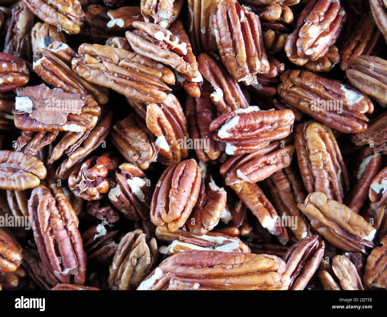 Closeup of pecan nuts for background Stock Photo - Alamy