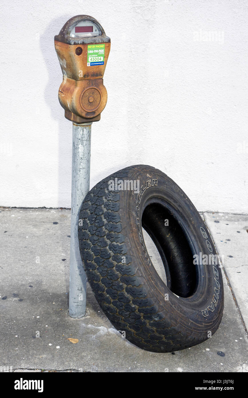 Miami Florida,Flagler Street,parking meter,rusted,trash,old tire ...